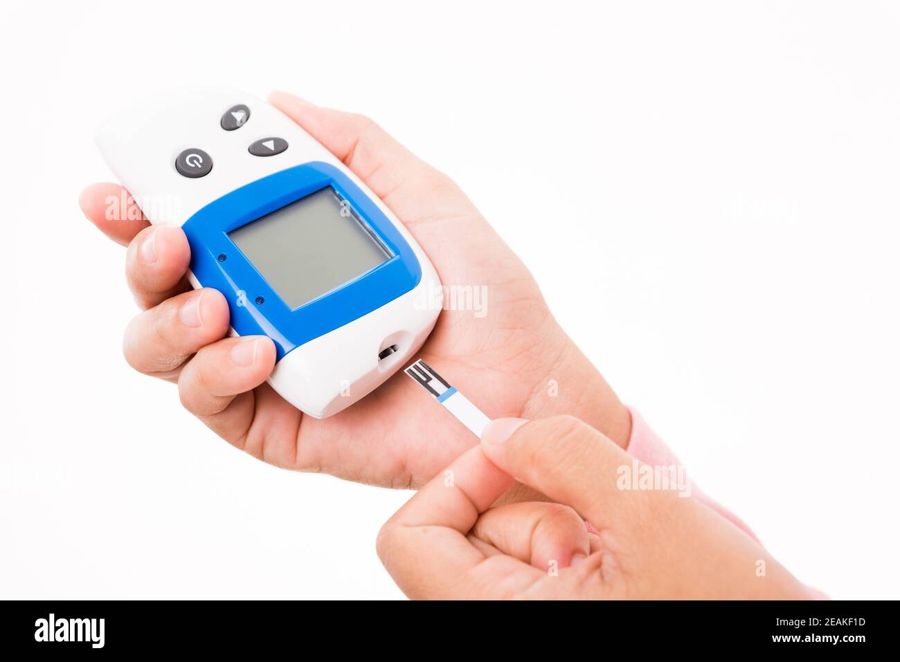woman measuring glucose test level checking on a finger by glucometer ...