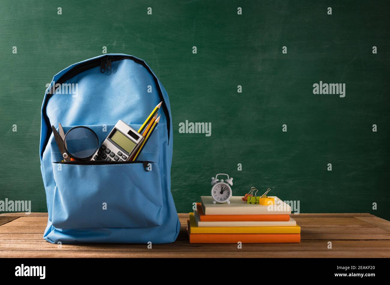 Front of stylish school bag backpack and stationery Stock Photo - Alamy