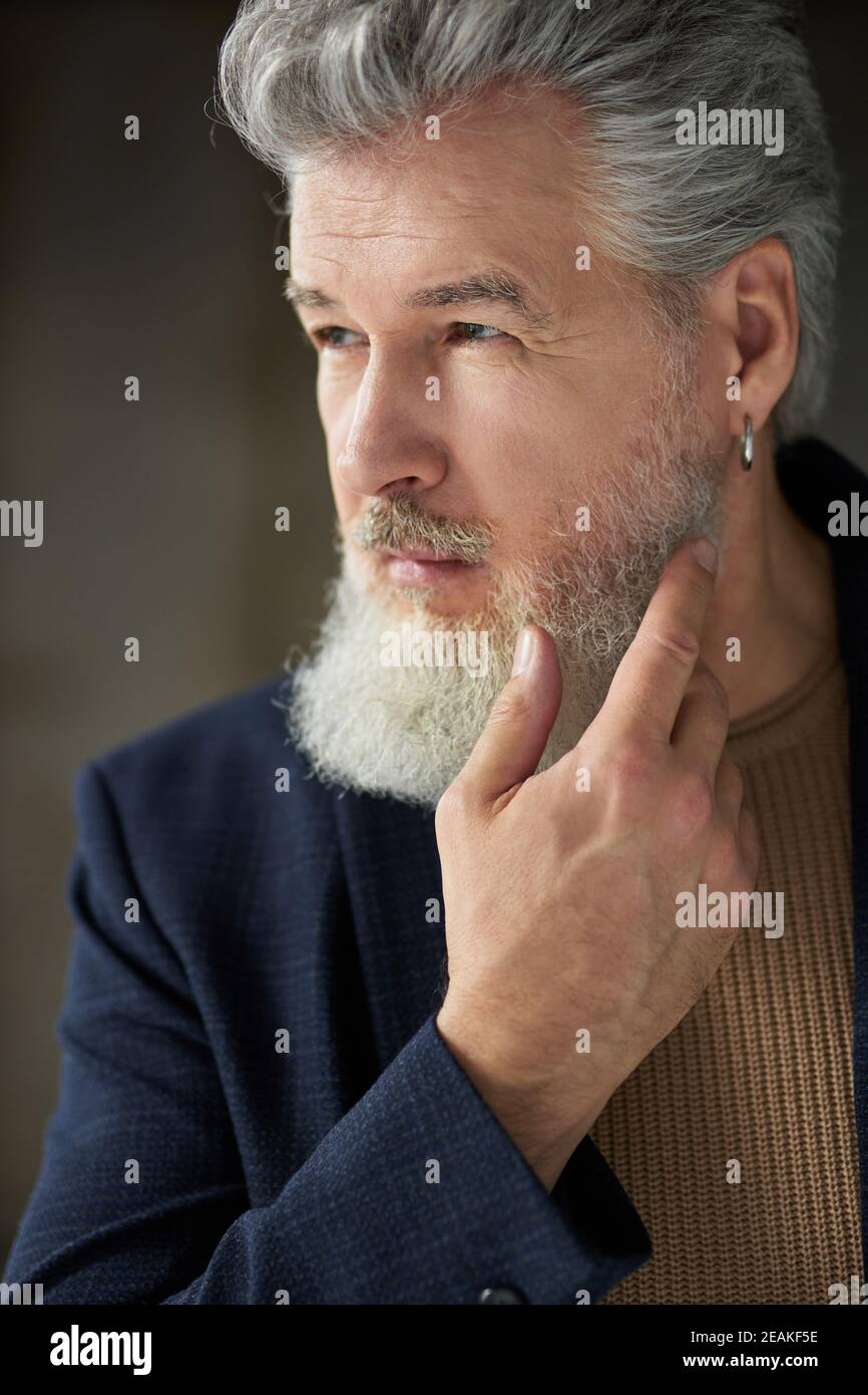 Close up portrait of stylish handsome grey haired middle aged man ...