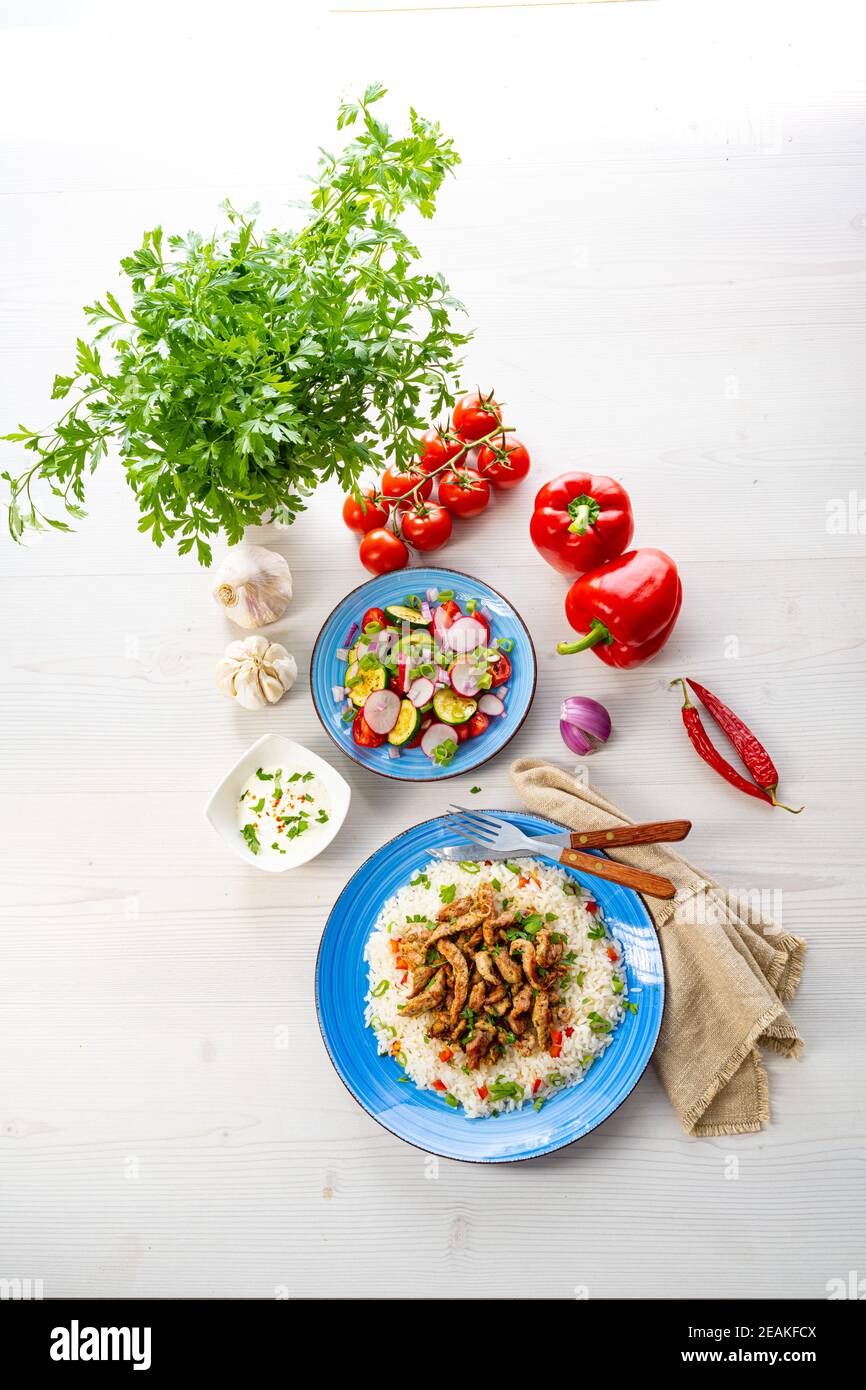 gyros with rice and green salad and zaziki Stock Photo - Alamy