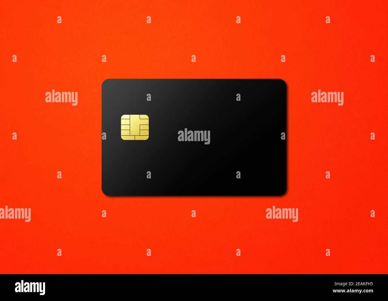 Black credit card on red background Stock Photo - Alamy