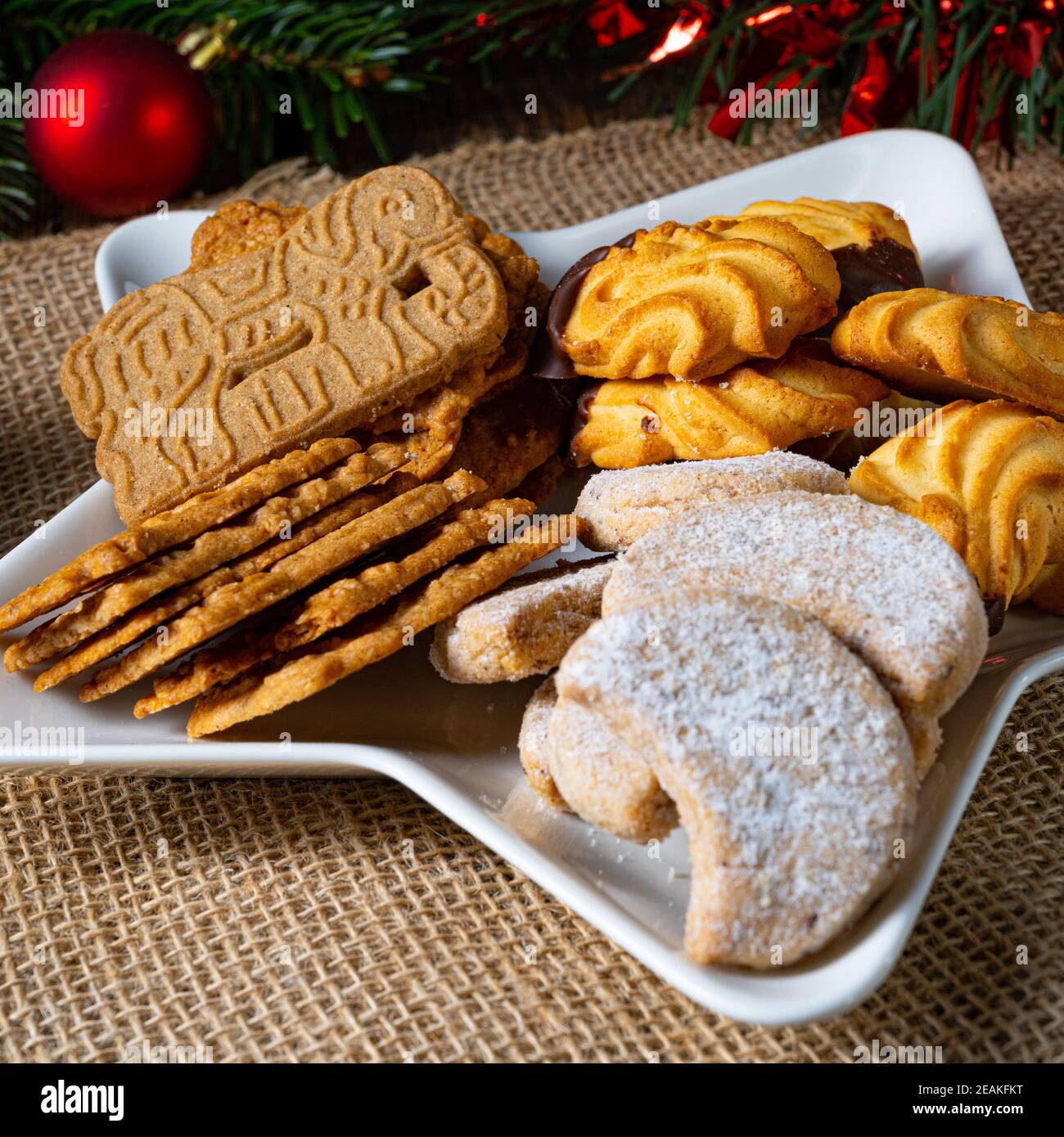 Different types of biscuits with rustic Christmas decorations Stock ...