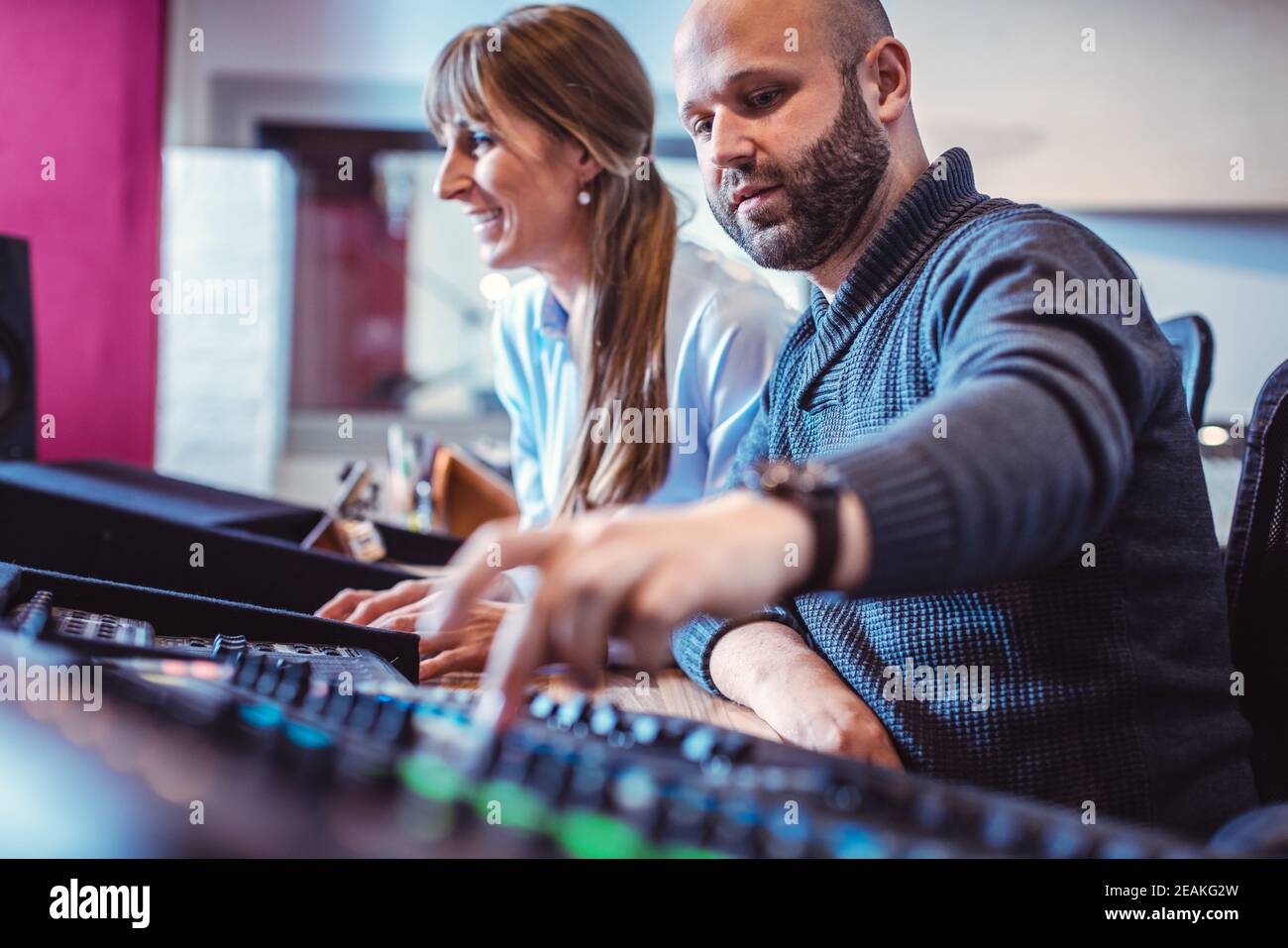 Singer or artist and sound engineer working in the studio Stock Photo ...