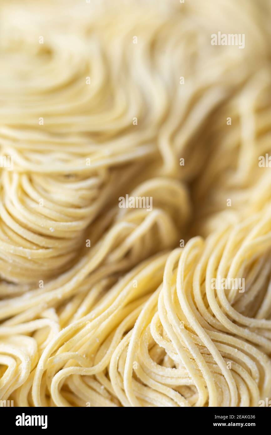 raw uncooked chinese yellow egg noodle Stock Photo - Alamy