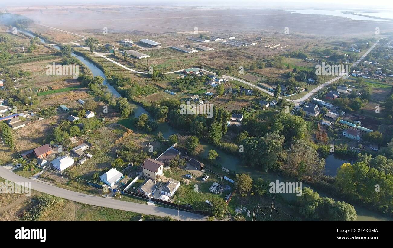 View from the top of the village. Houses and gardens. Countryside ...
