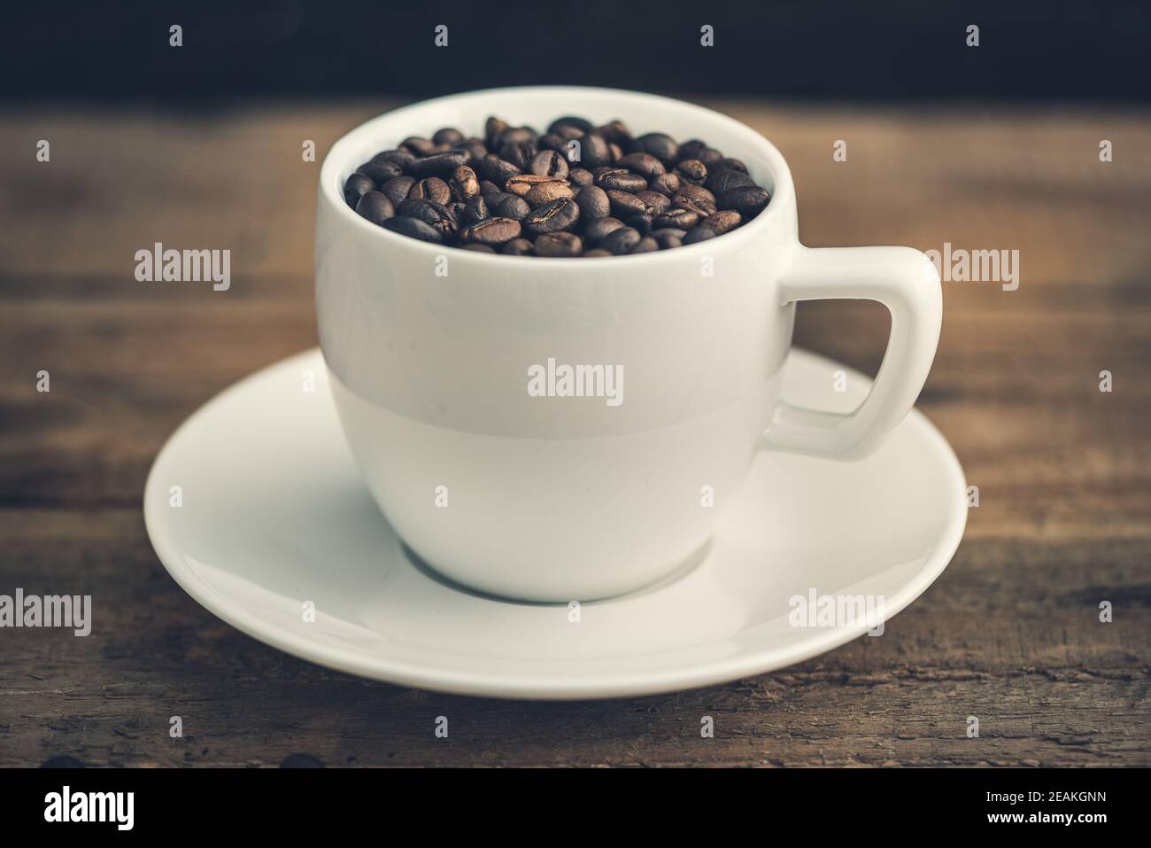 White cup filled with coffee beans hi-res stock photography and images ...