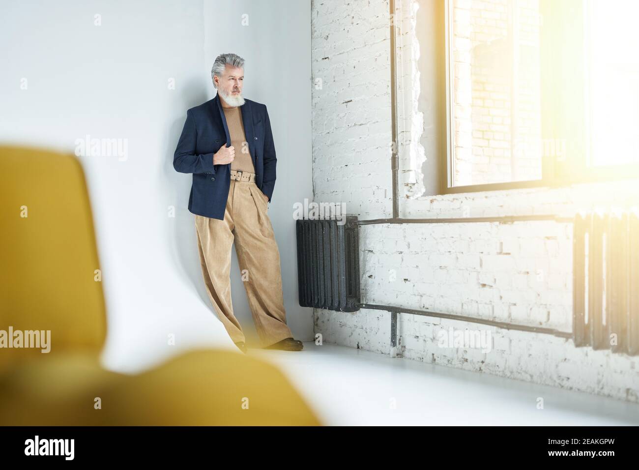 Full length shot of stylish middle aged man in business casual wear ...