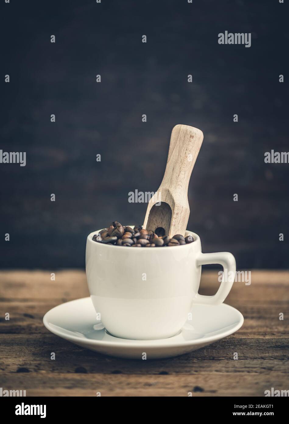 White cup filled with coffee beans hi-res stock photography and images ...