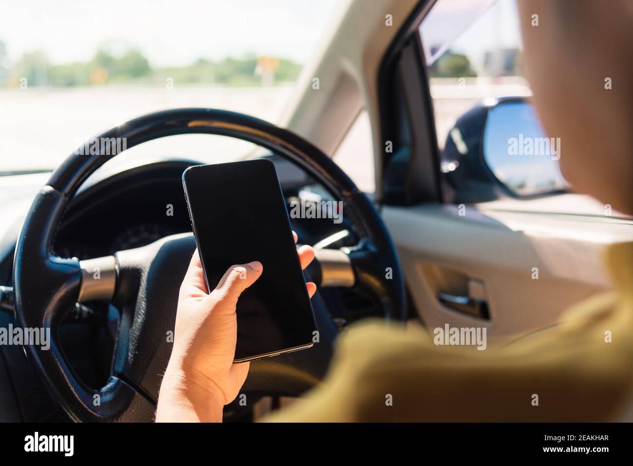 woman inside a car and using a hand holding mobile smartphone Stock ...