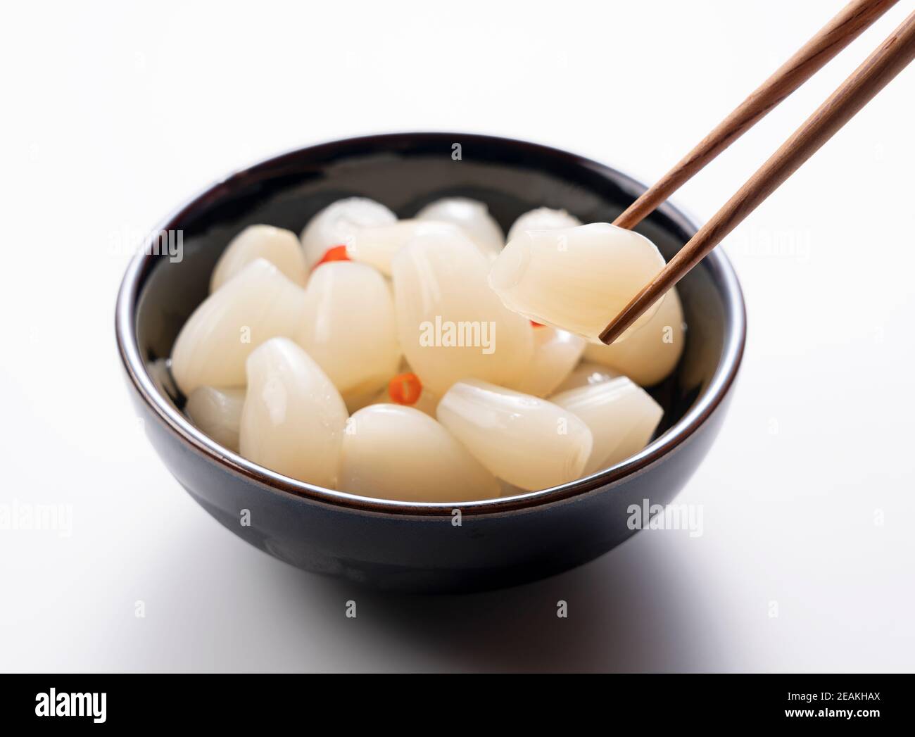 Japanese Rakkyo placed on a white background Stock Photo - Alamy