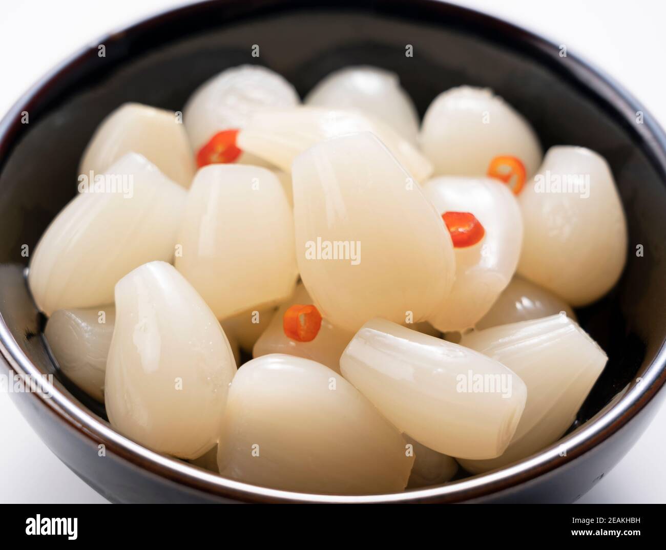 Japanese Rakkyo placed on a white background Stock Photo - Alamy