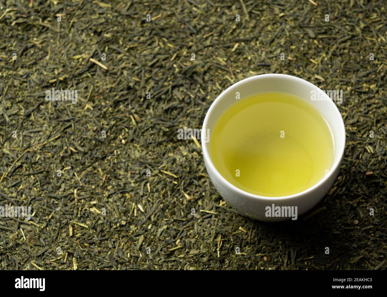 Tea leaves laid across the screen. Green tea placed on it Stock Photo ...