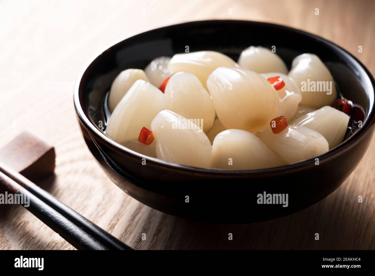 Japanese Rakkyo placed on a wooden background Stock Photo - Alamy