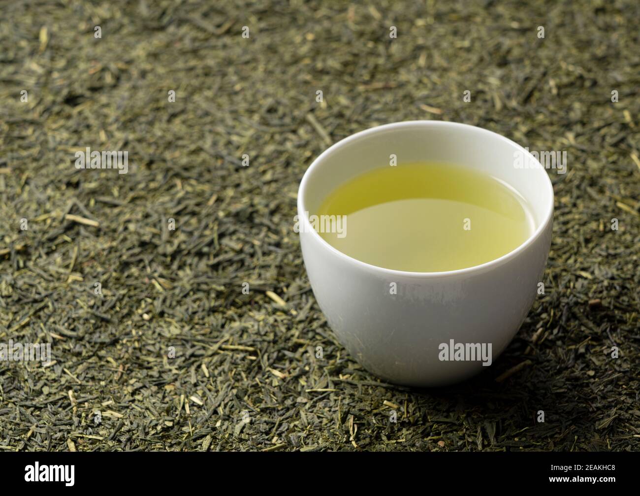 Tea leaves laid across the screen. Green tea placed on it Stock Photo ...