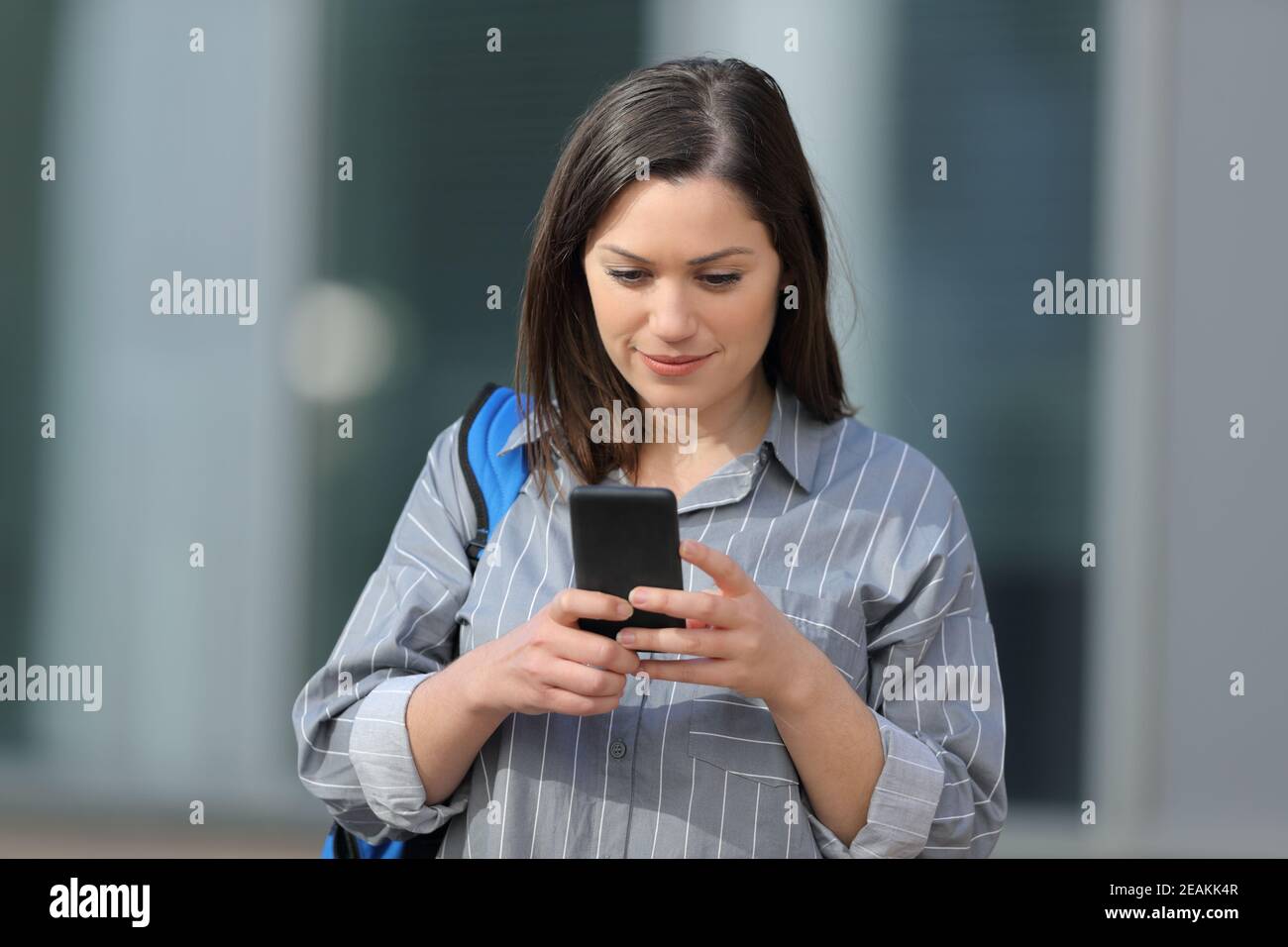 College student walking street mobile hi-res stock photography and ...