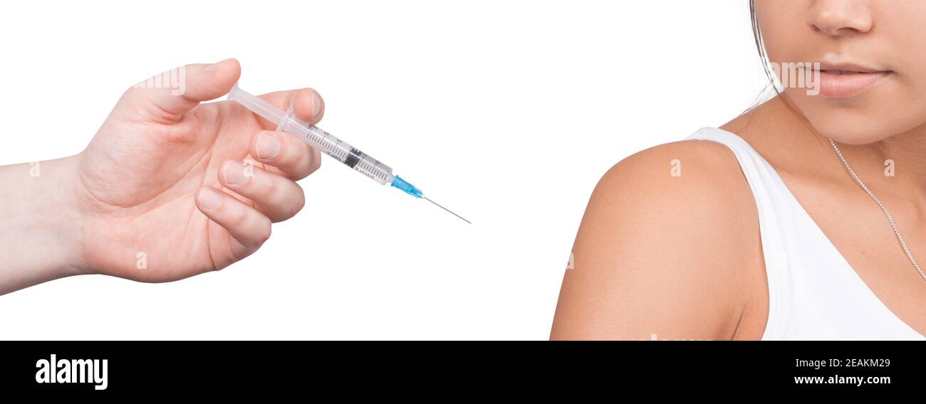 Doctor gives a syringe with vaccine to patient at clinic Stock Photo ...