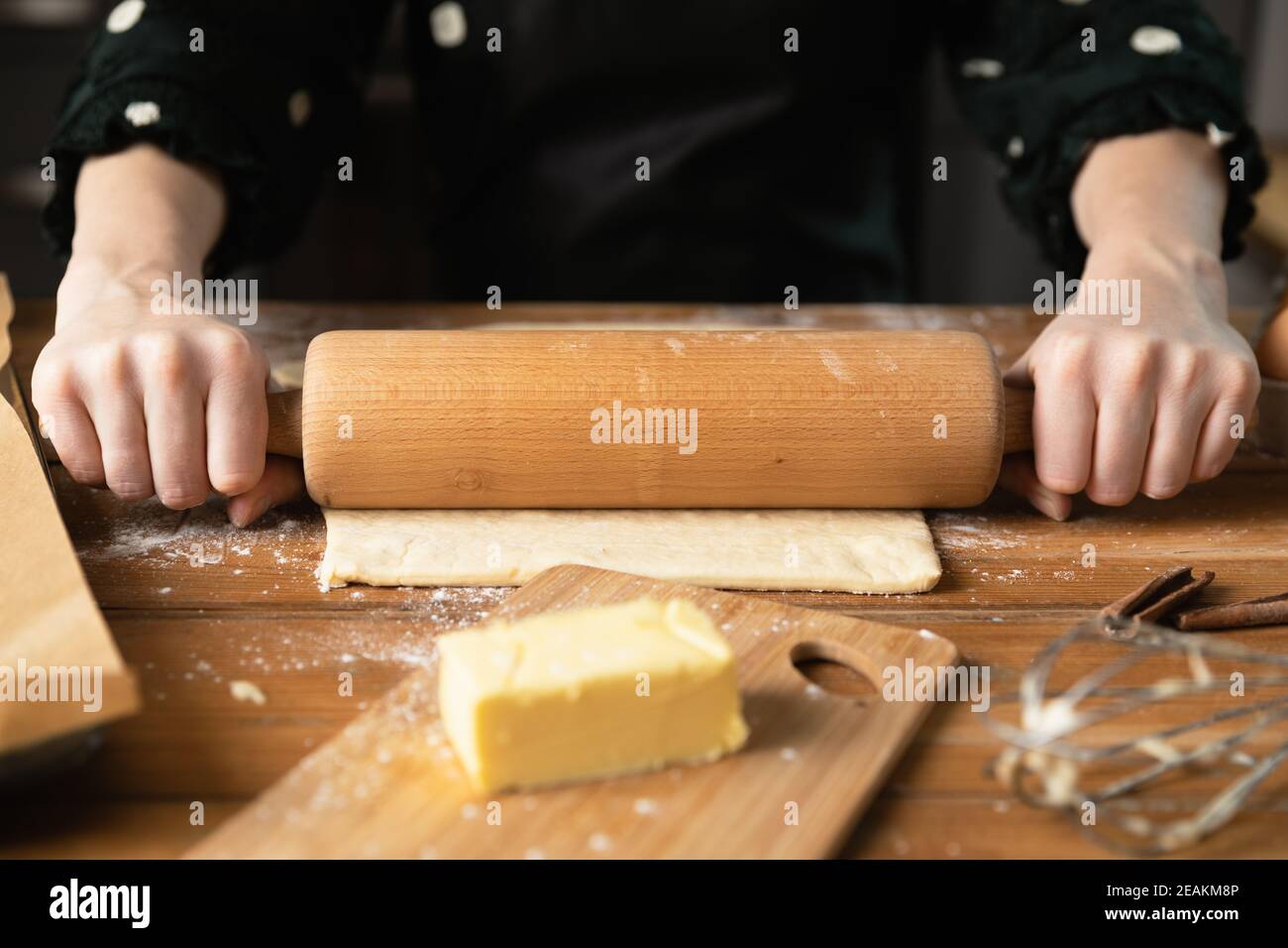 Women preparing homemade food pie, pizza, pasta with a dough roll ...