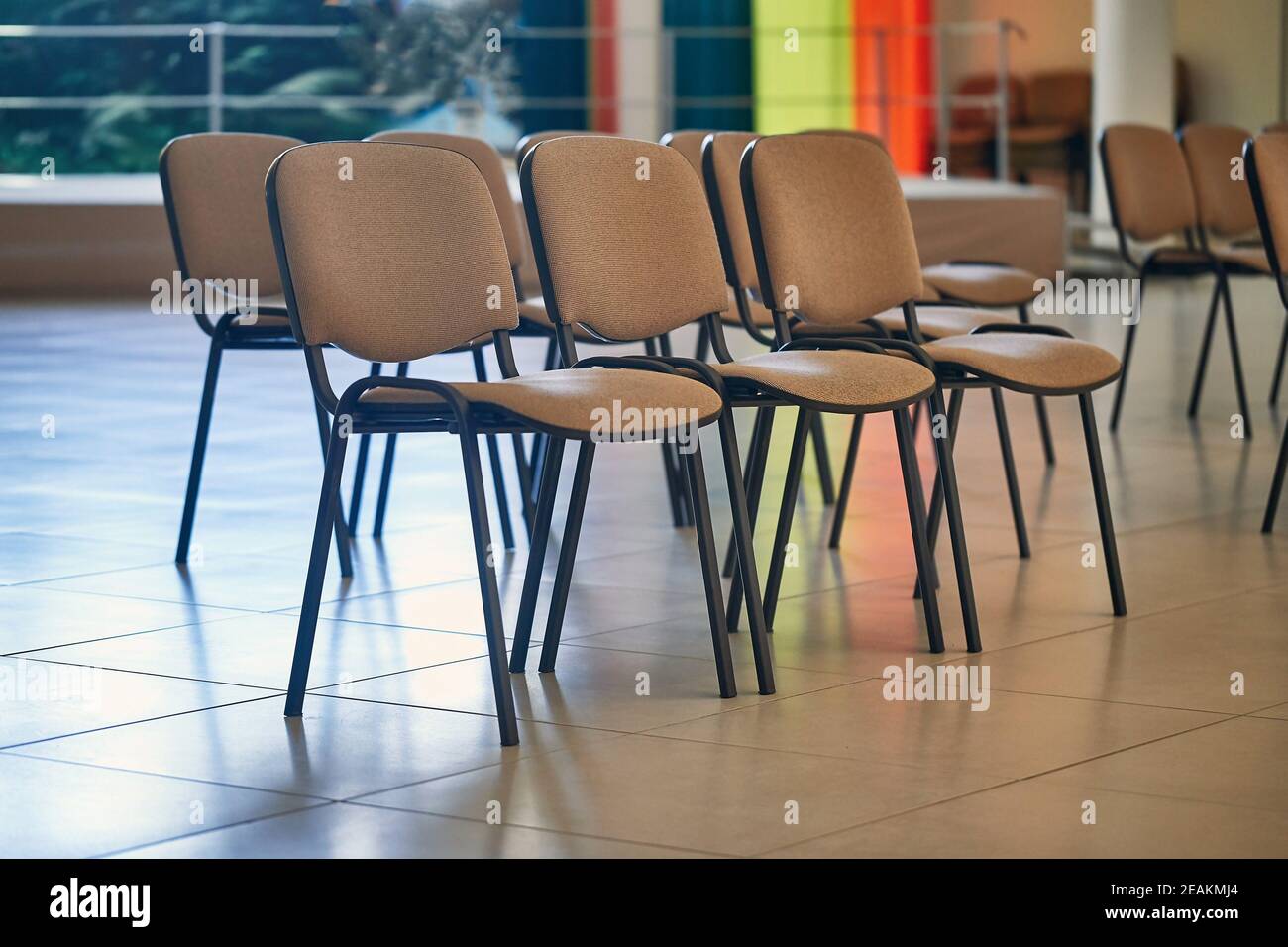 Row of empty small chairs hi-res stock photography and images - Alamy