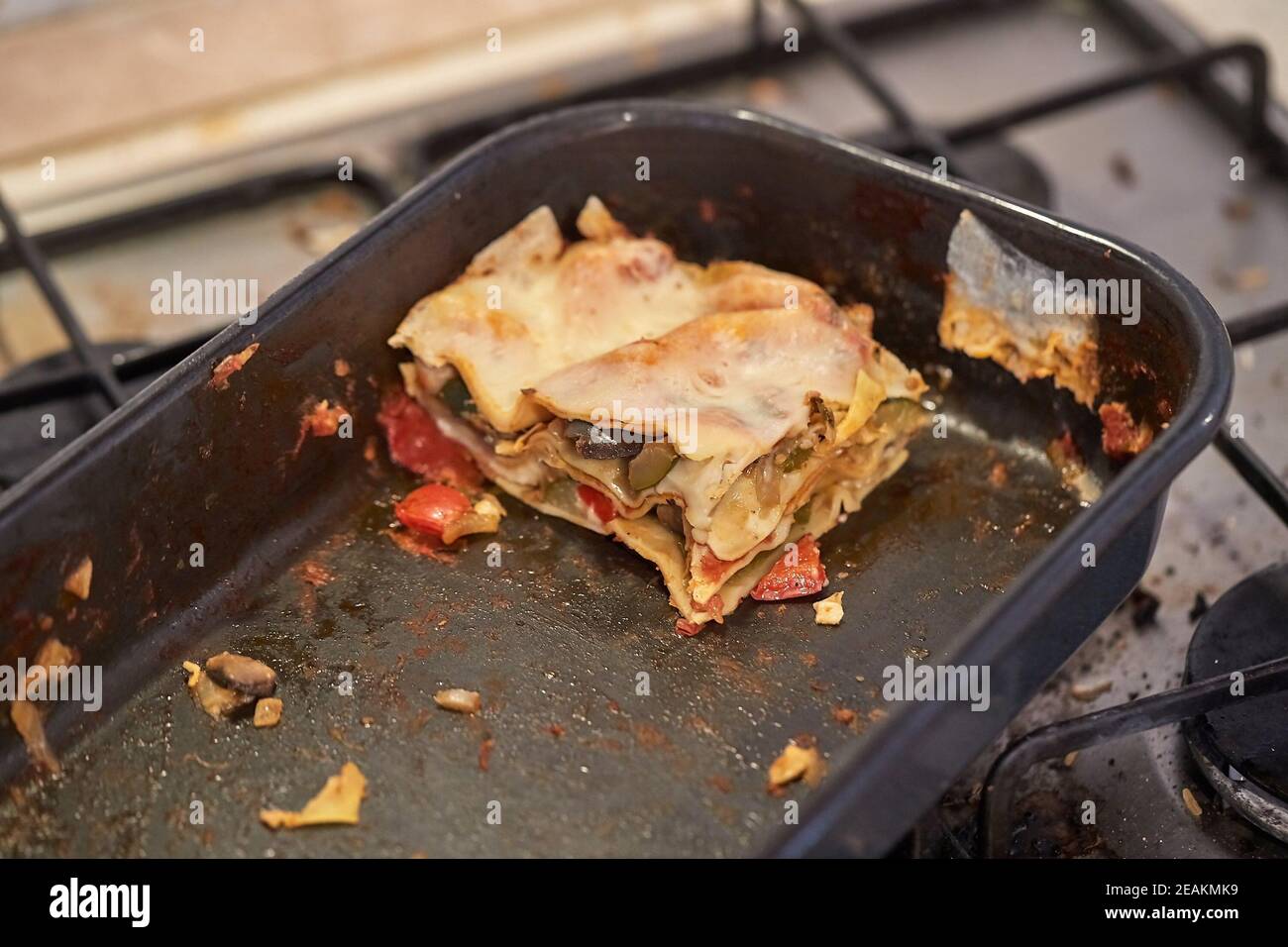 Lasagna leftover in a dirty kitchen Stock Photo - Alamy