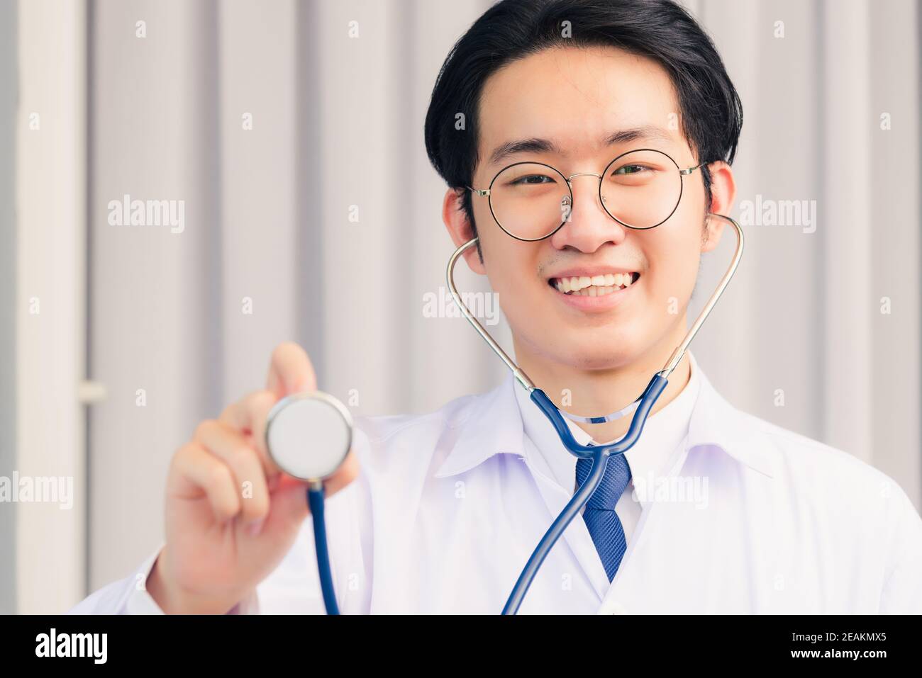 Doctor handsome man show stethoscope Stock Photo - Alamy