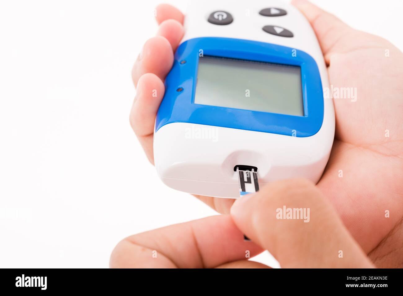 woman measuring glucose test level checking on a finger by glucometer ...