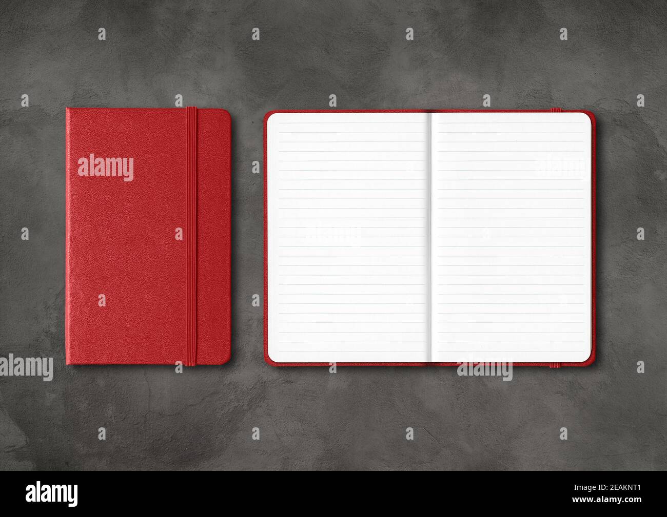 Dark red closed and open lined notebooks on black concrete background ...