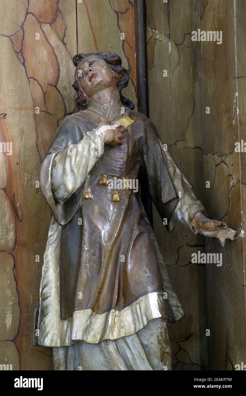 Saint Lawrence of Rome statue on the altar of Saint Anthony of Padua in ...