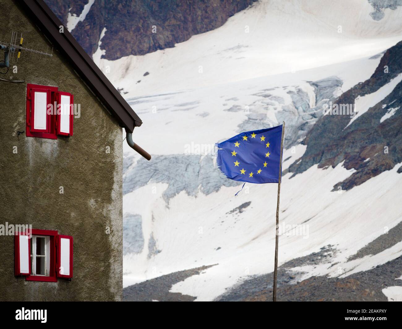 EU Flag In The Alps , Snowy Mountains, Mountain Hut, House. European ...