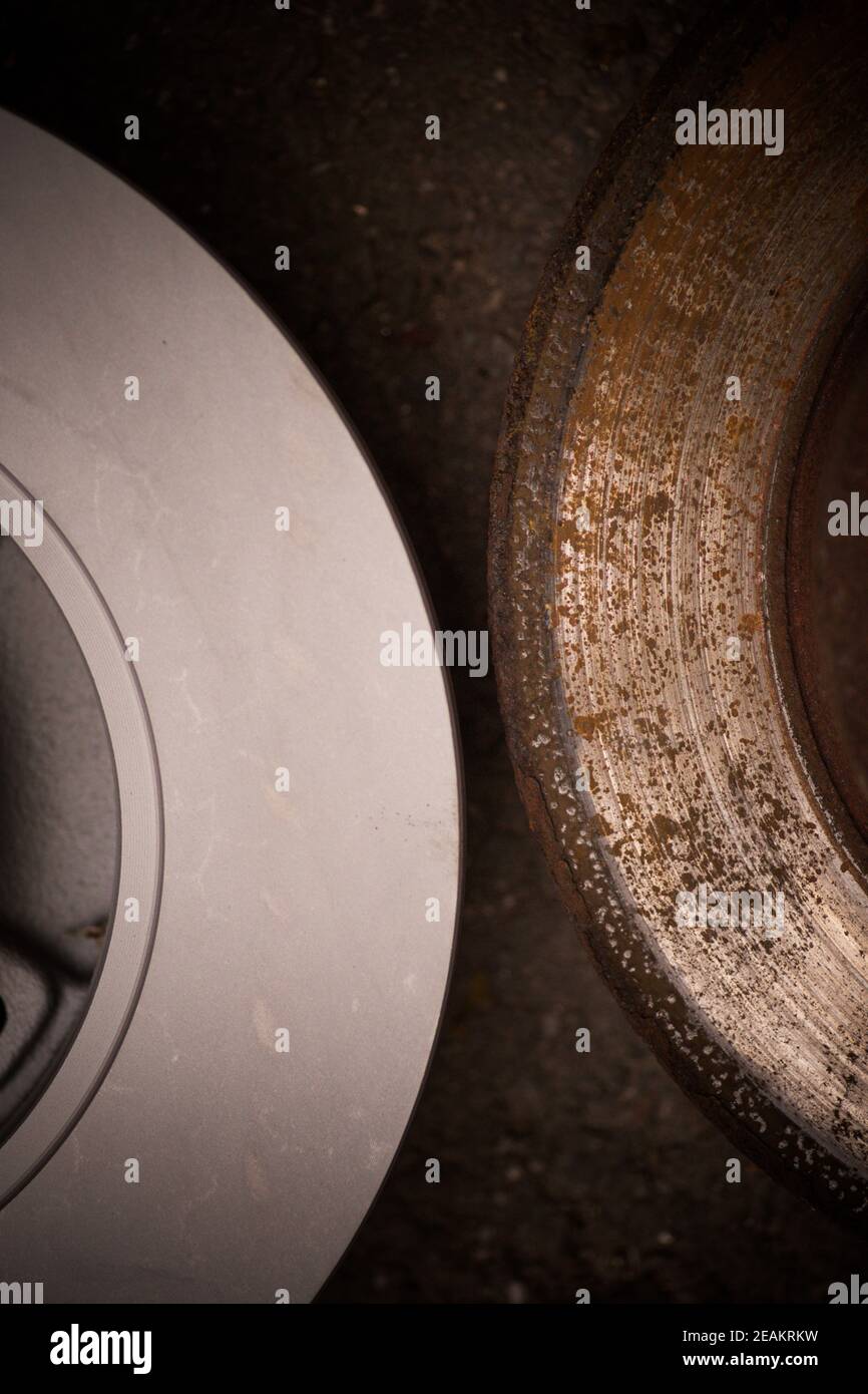 Car worn and rusty brake disk and a new one Stock Photo - Alamy