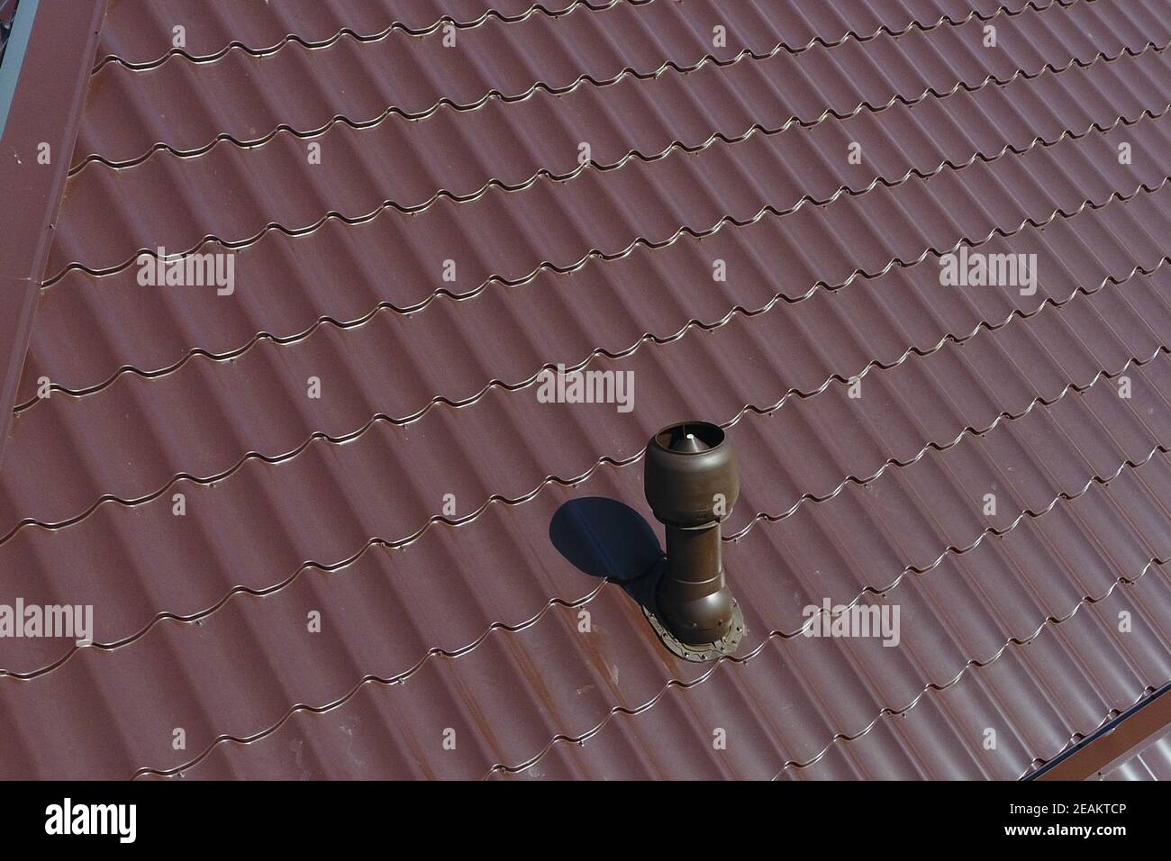 Air ducts on metal roof. The roof of corrugated sheet. Roofing of metal ...
