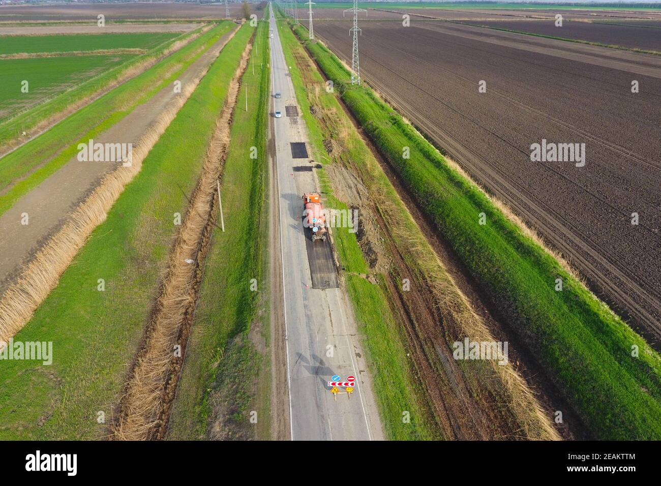 Top view of the road repair. Technics for repair of asphalt ...