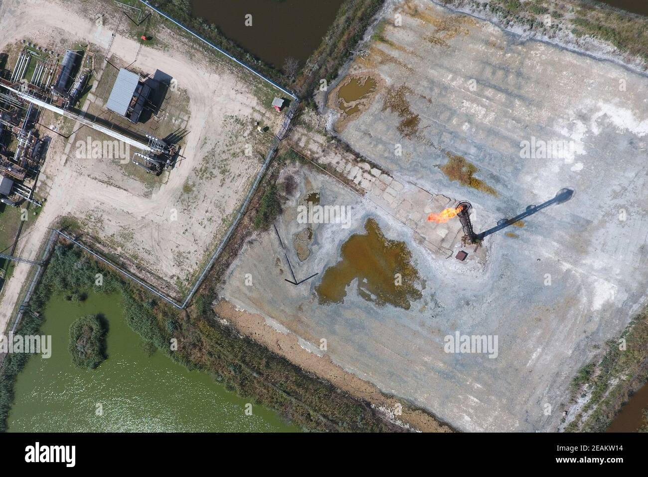 Torch system on an oil field Stock Photo - Alamy