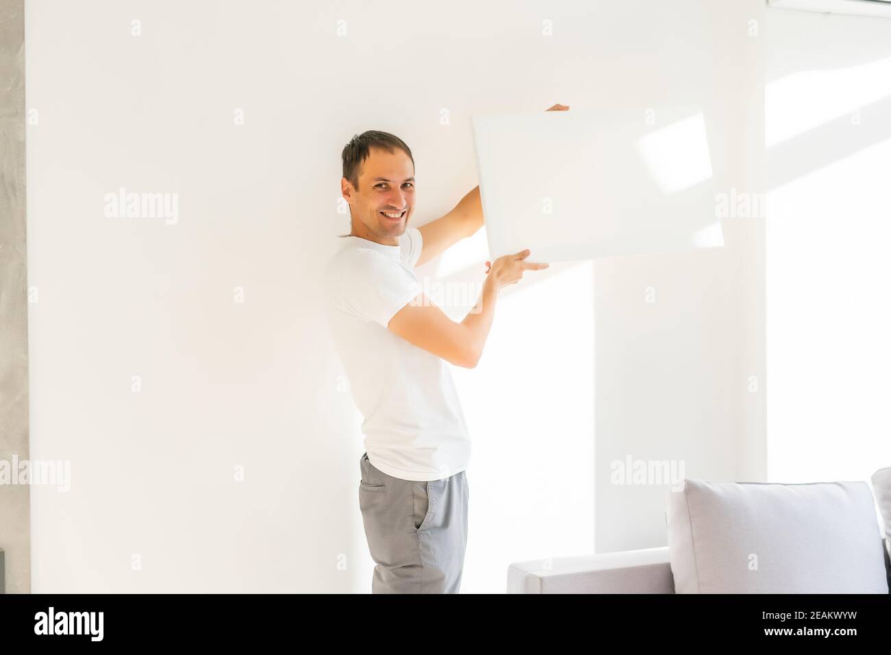 man with canvas mockup. Photo Mockup. The man hold canvas. For canvas ...