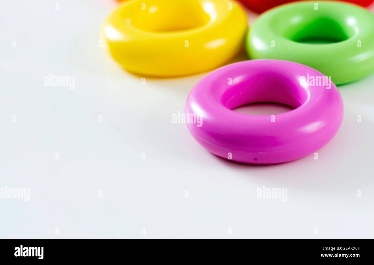 colorful plastic rings isolated on a white background Stock Photo - Alamy