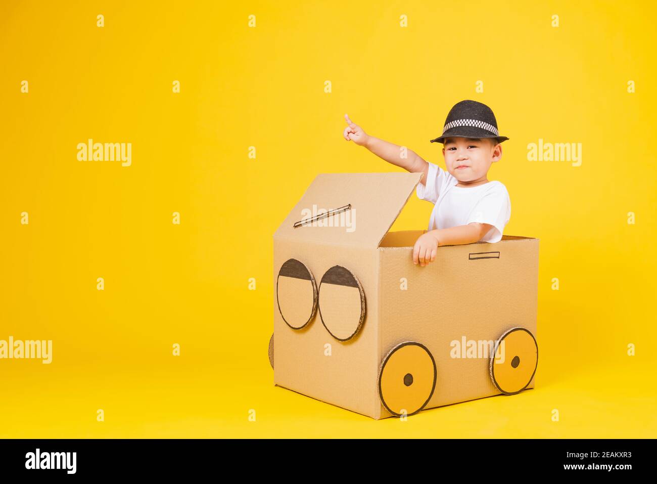 little children boy smile so happy driving car creative by cardboard ...