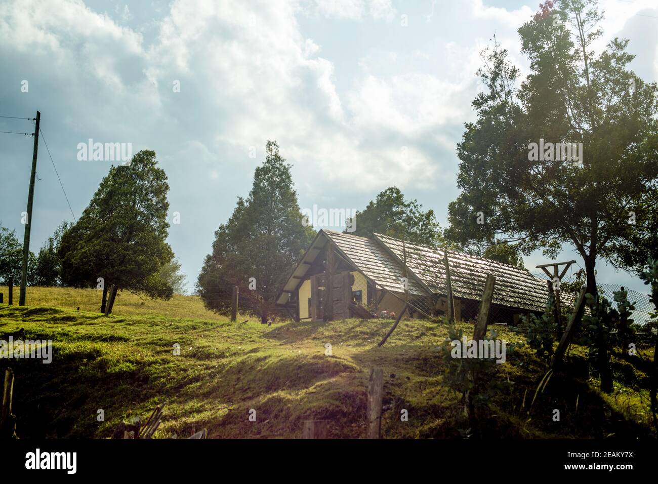 Beautiful view of a rustic house in the woods Stock Photo - Alamy
