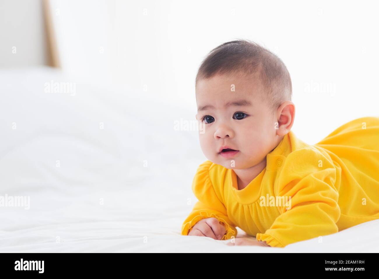 newborn little baby prone on the bed at home Stock Photo - Alamy