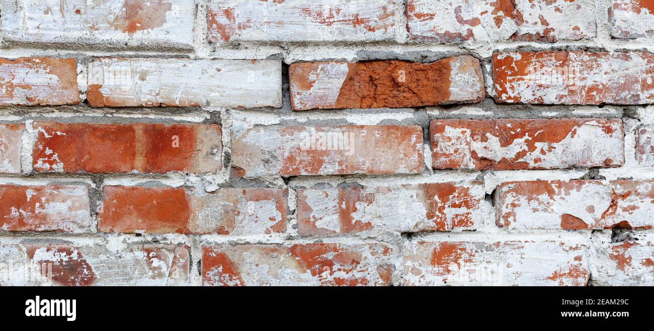 Rustic red brick background with white paint Stock Photo - Alamy