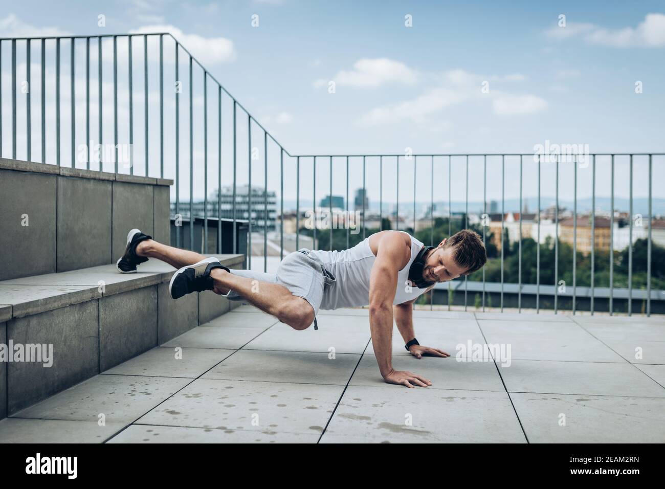 Outdoor workout on a rooftop terrace Stock Photo - Alamy