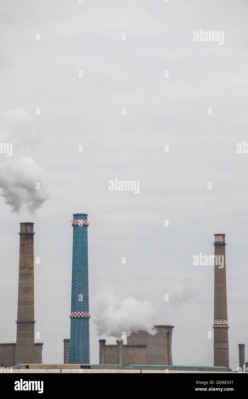 Factory chimneys with smoke Stock Photo - Alamy