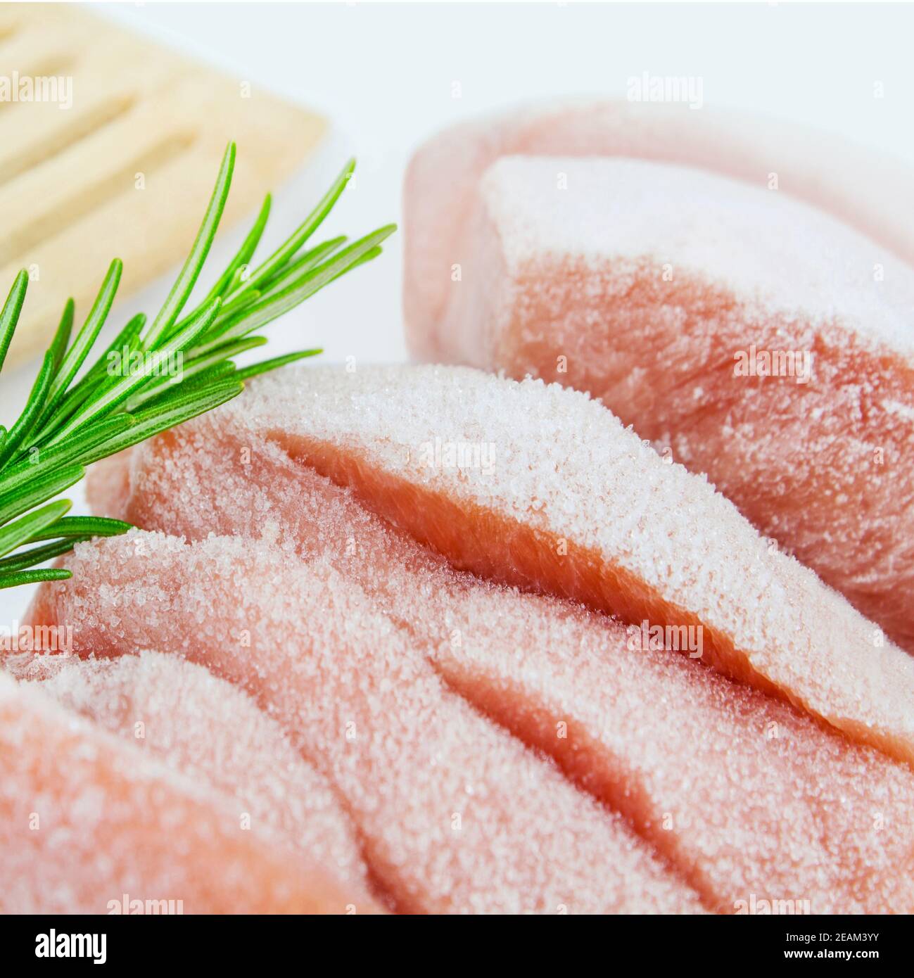 Deep frozen turkey hen and rosemary Stock Photo - Alamy
