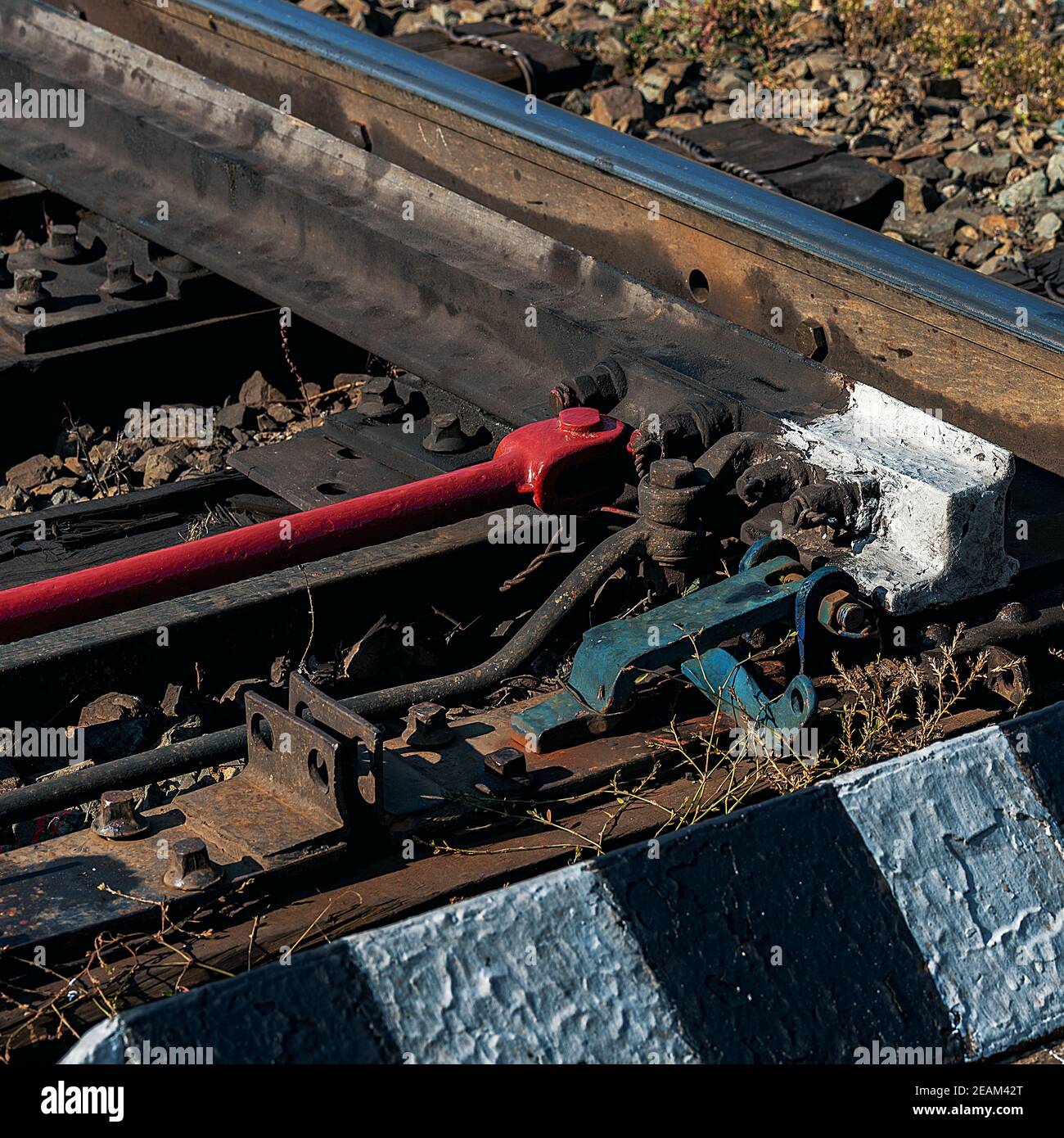 Close-up of the railway switch mechanism. The translation of the arrow ...