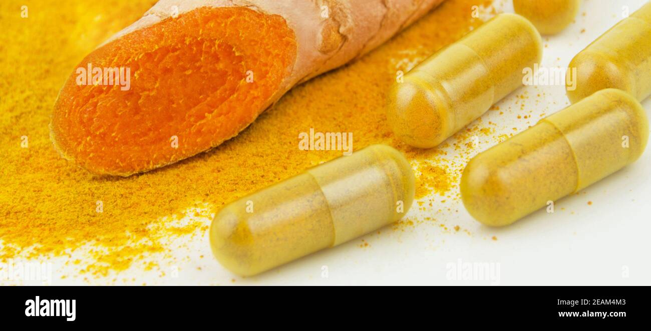 Curcuma capsules and powder with root Stock Photo - Alamy