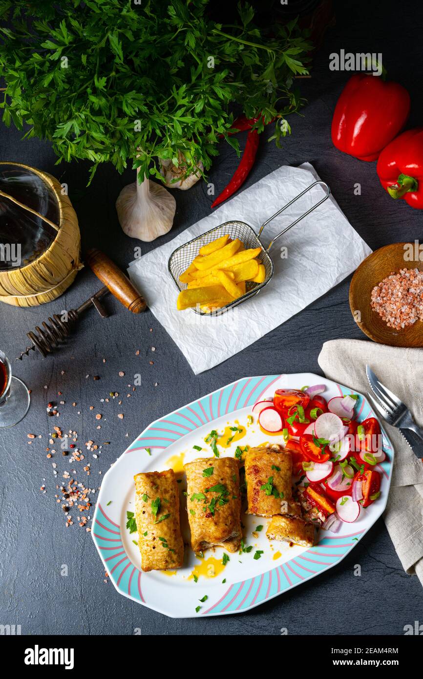 Vegetable roulade from roast pork loins with salads Stock Photo - Alamy