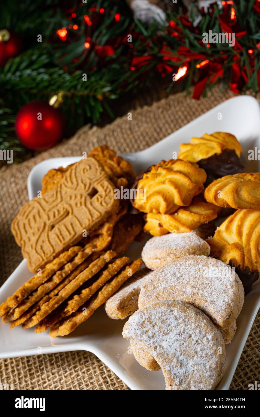Different types of biscuits with rustic Christmas decorations Stock ...