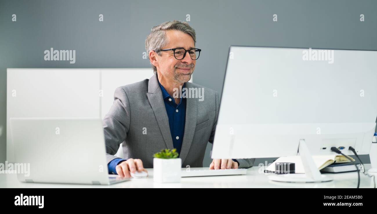 Happy Professional Man Employee Using Computer Stock Photo - Alamy