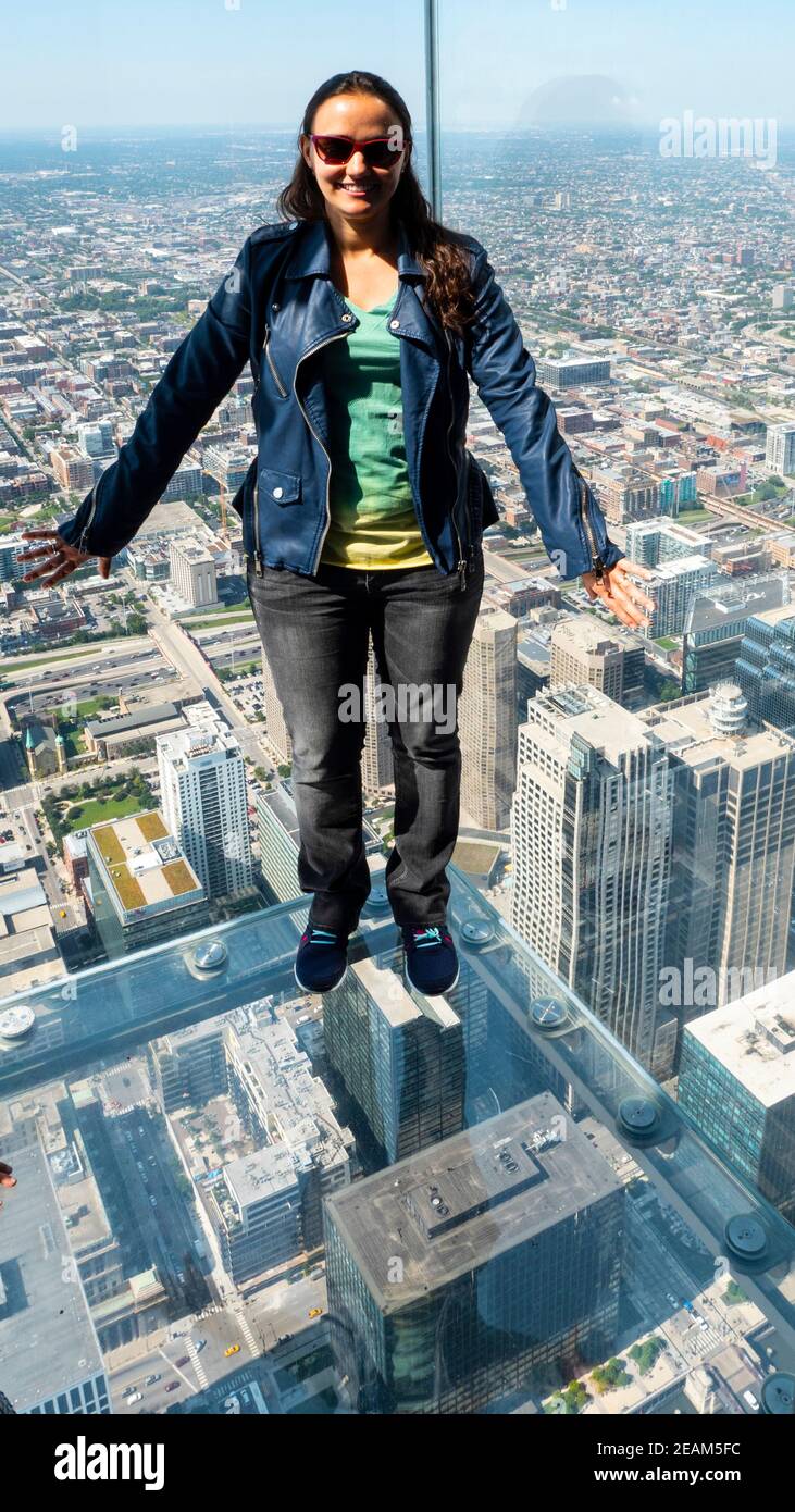 woman in glass box in Chicago Illinois Stock Photo - Alamy