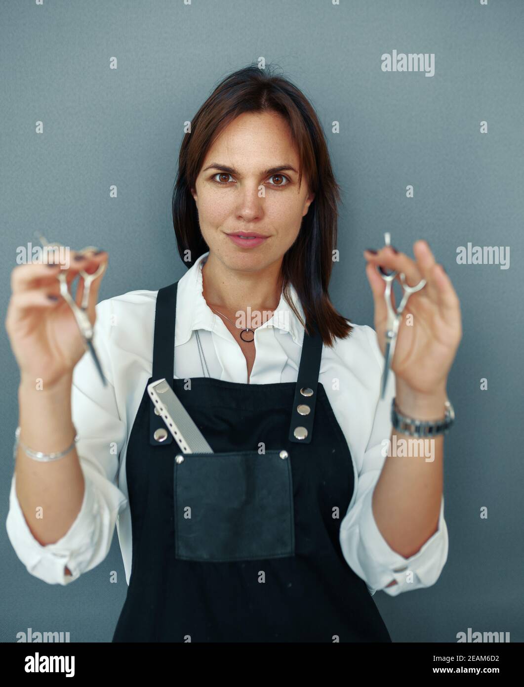 Holds Scissors High Resolution Stock Photography and Images - Alamy