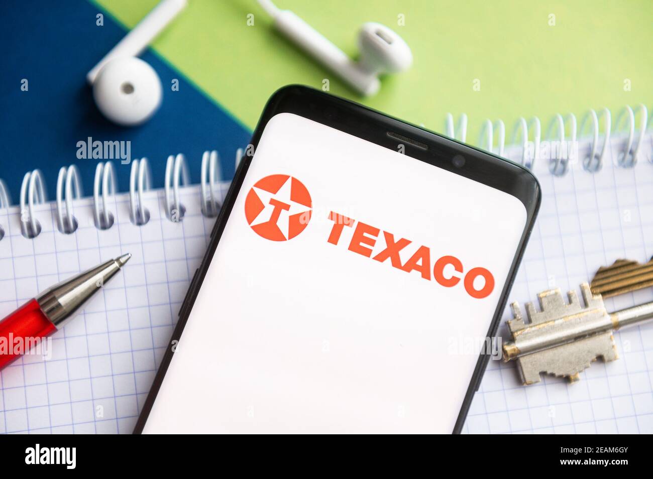 In this photo illustration, a Texaco logo seen displayed on a ...