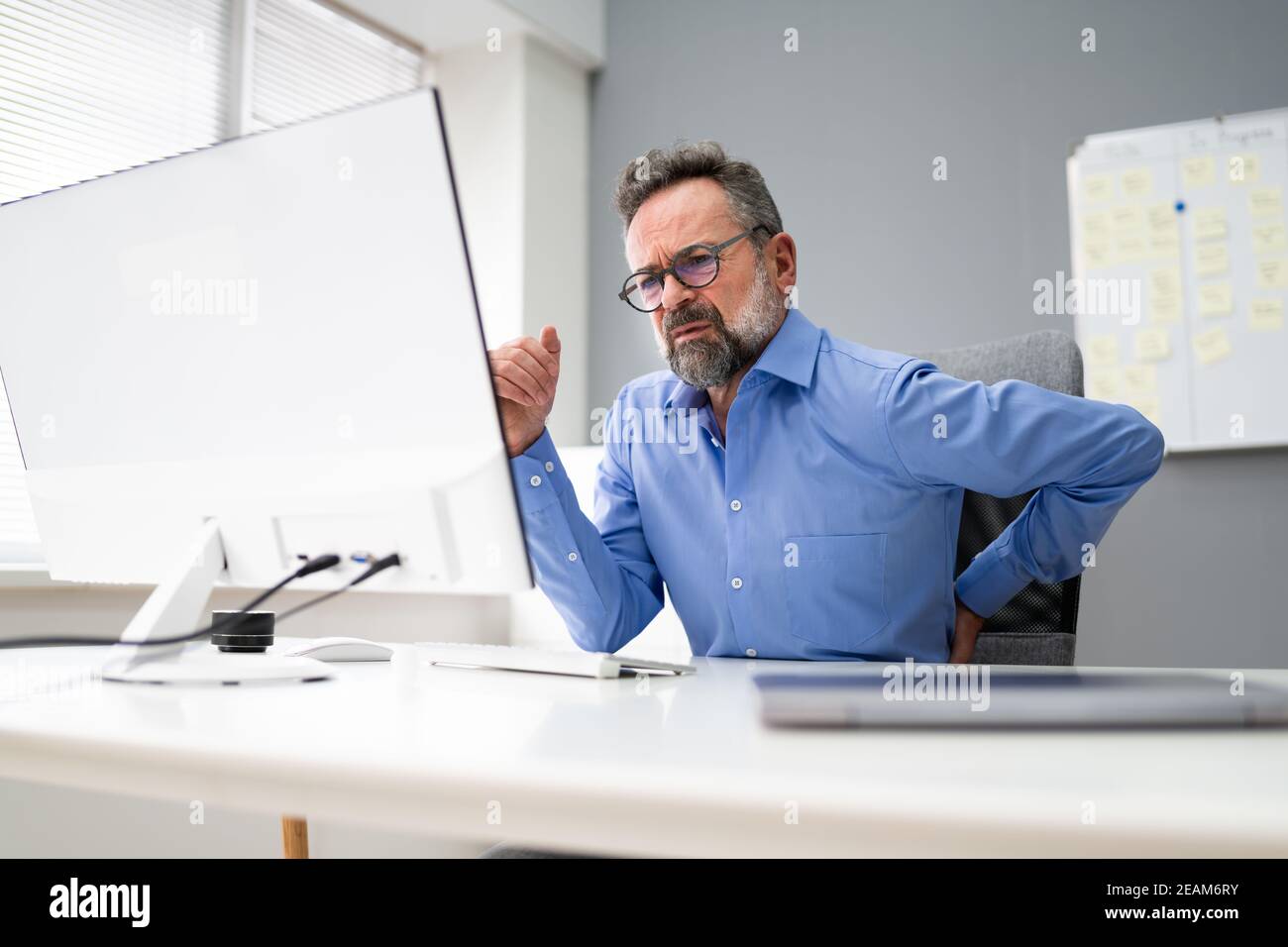 Back pain computer in hi-res stock photography and images - Alamy
